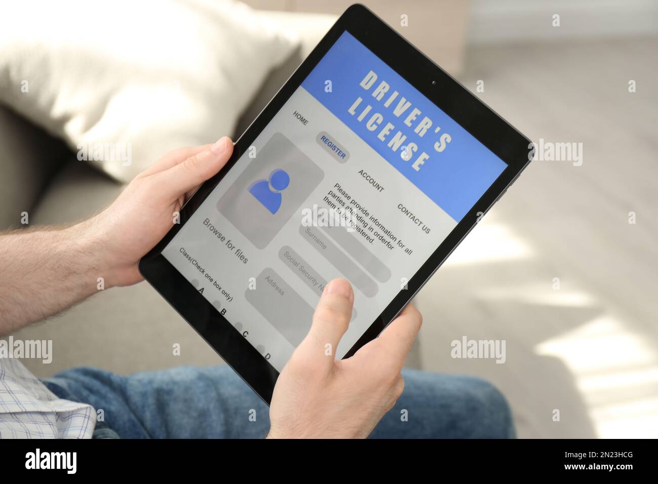 Man holding tablet with driver's license application form at home, closeup Stock Photo - Alamy