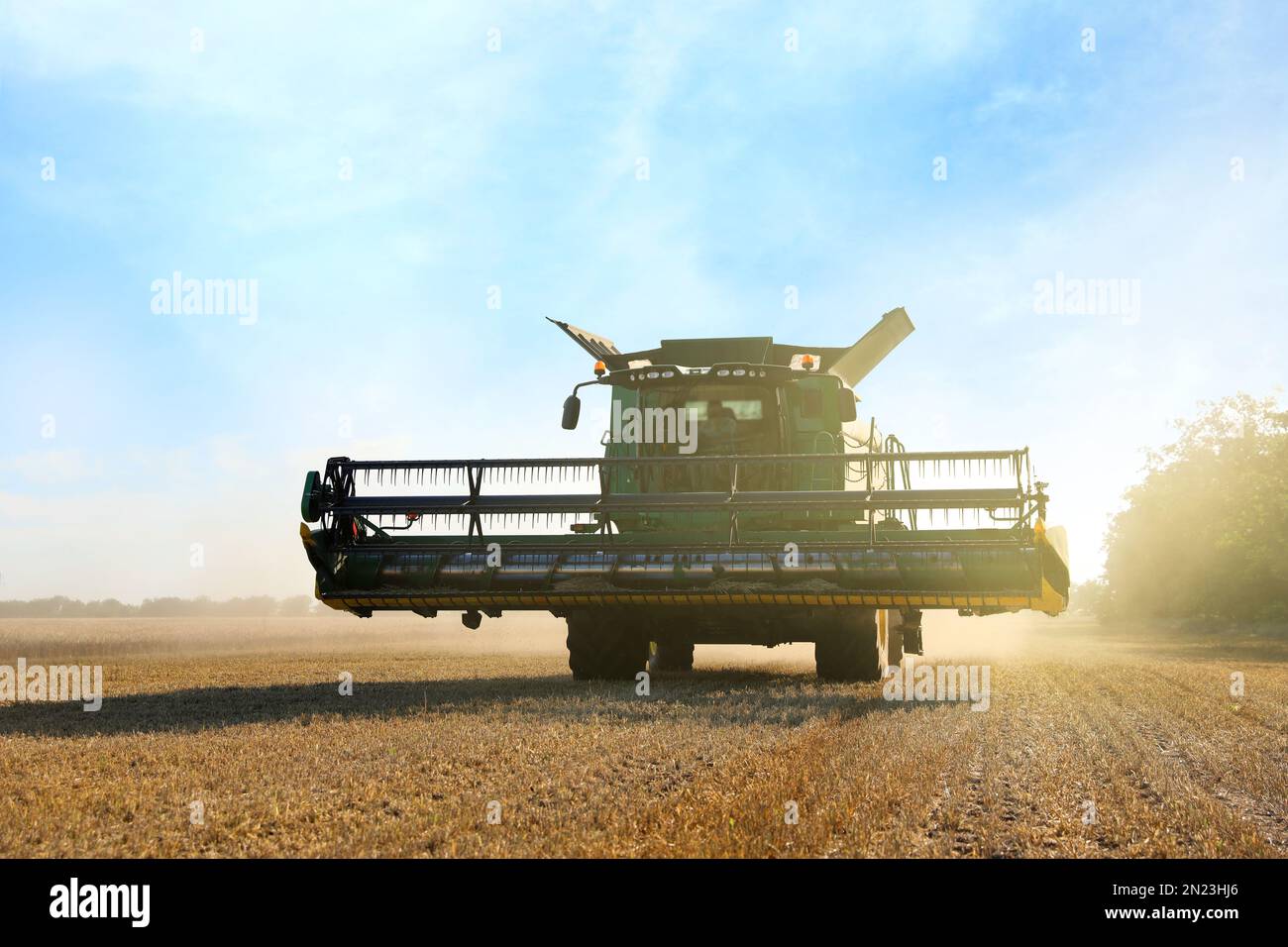 Modern combine harvester in field. Agricultural industry Stock Photo ...