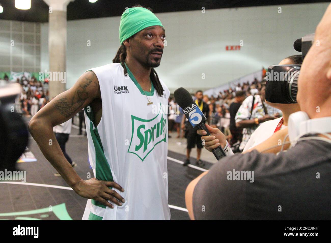 Snoop Dogg is interviewed during the Sprite Celebrity Basketball Game ...
