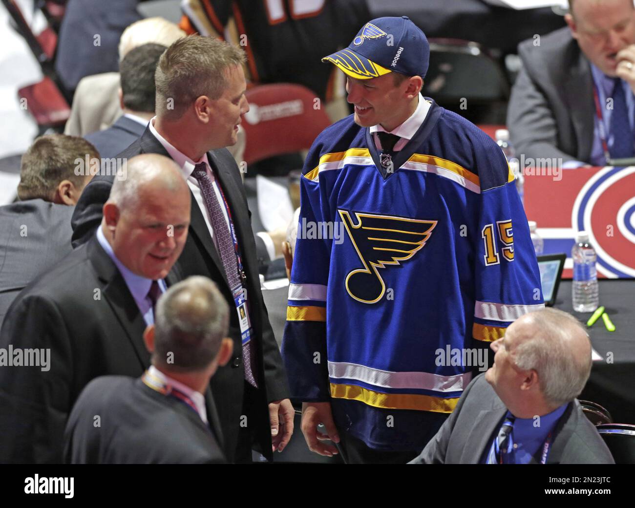 Adam Musil talks to team executives after being chosen 94th overall by ...