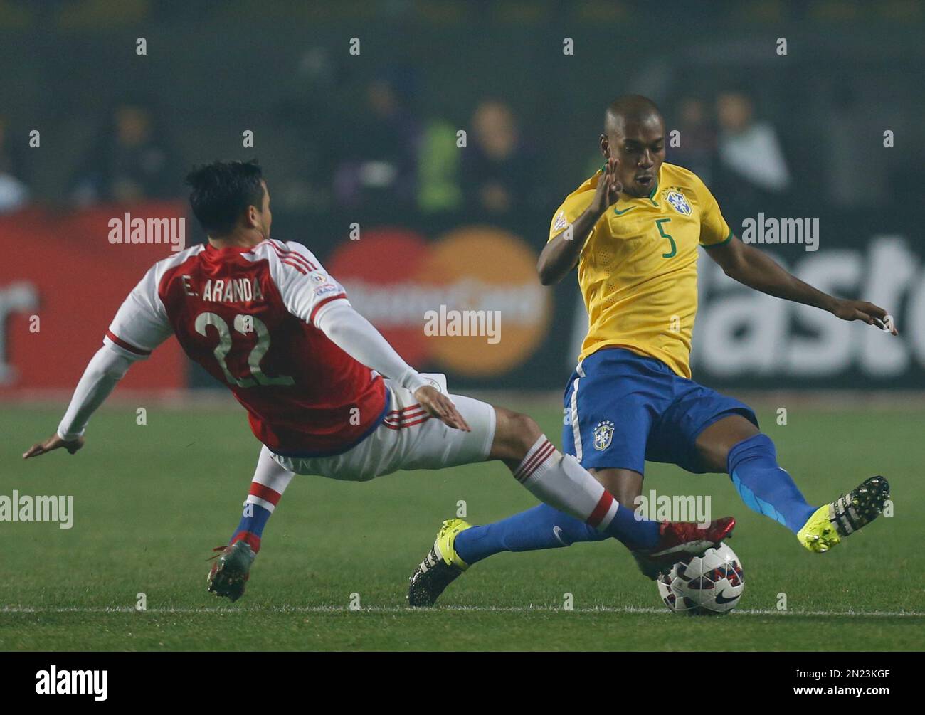 Brazil's Fernandinho, right, fight for the ball with Paraguay's Lorenzo ...