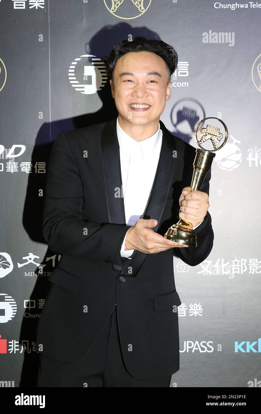 Hong Kong singer Eason Chen holds his award for the Best Male Mandarin ...