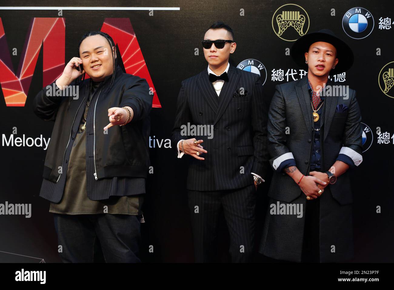 Taiwanese pop group MJ116 smile as they arrive at the 26th Golden ...