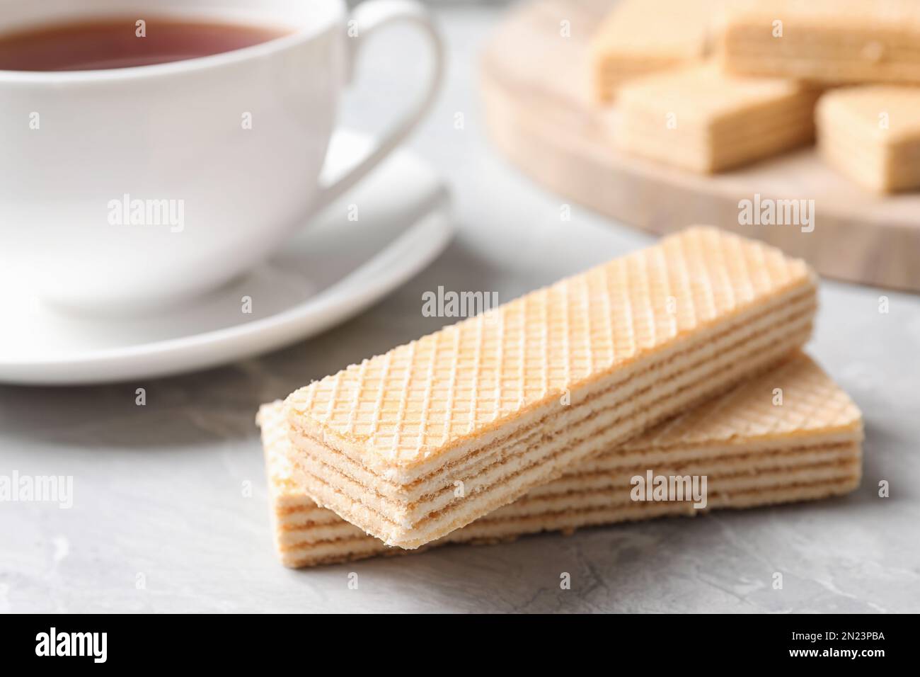 Delicious cream wafers on light grey marble table, closeup Stock Photo ...