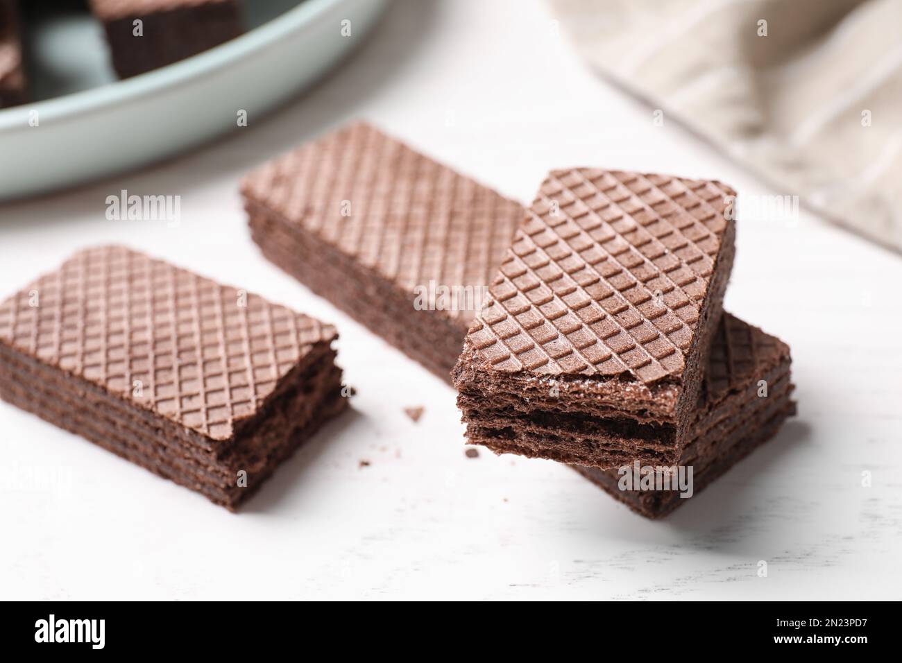 Delicious chocolate wafers on white table, closeup Stock Photo - Alamy