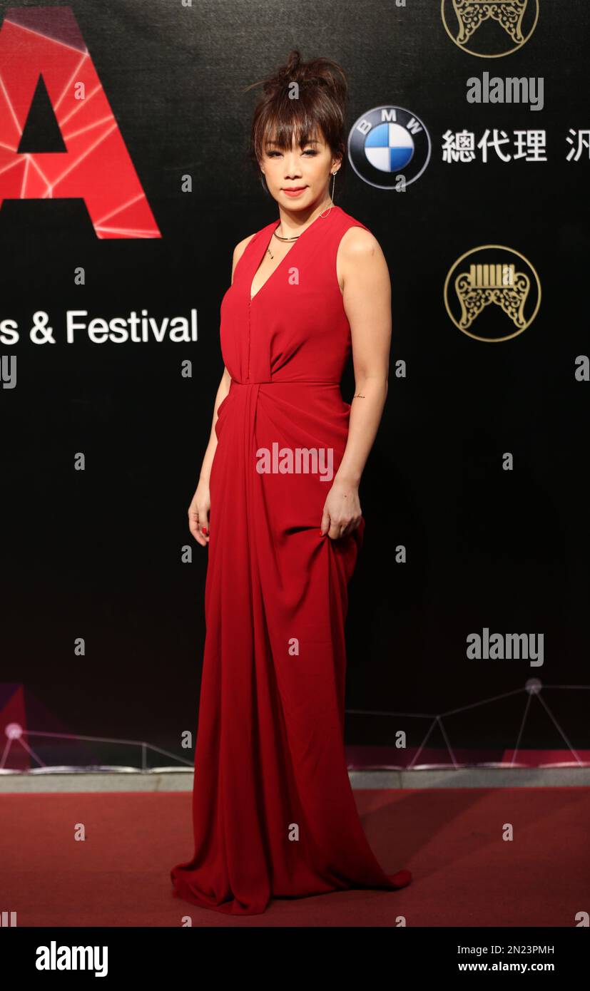 Hong Kong singer Sandy Lam smiles as she arrives at the 26th Golden ...