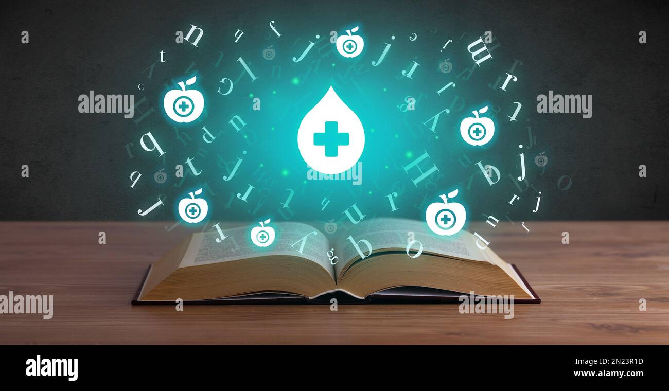 Open medical book with health icons above Stock Photo - Alamy