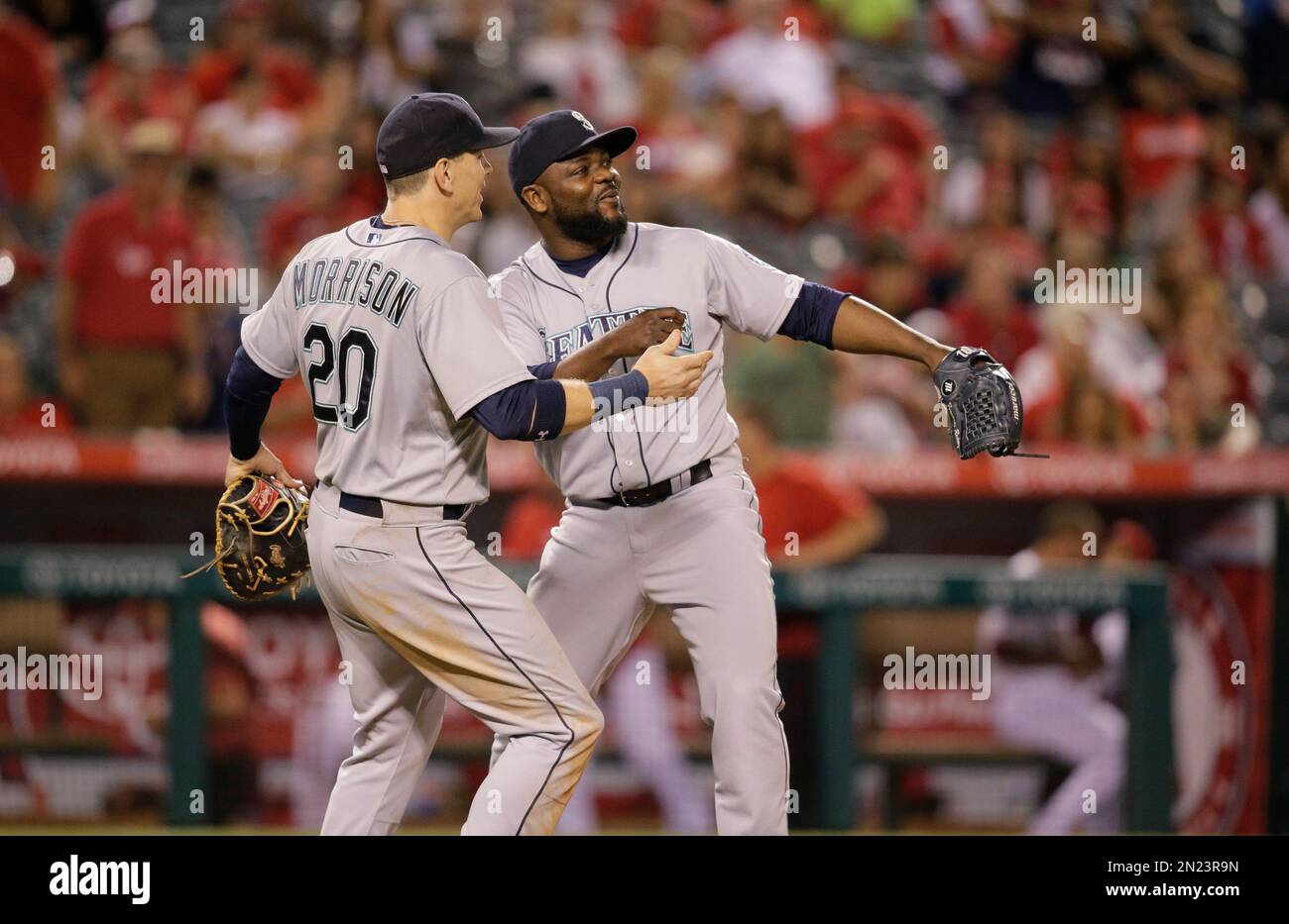 Seattle Mariners first baseman Logan Morrison, left, and relief pitcher ...