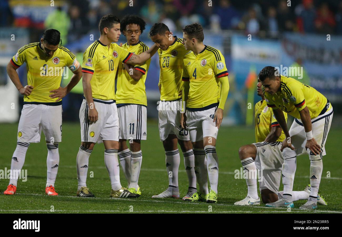 Colombia's Luis Muriel, 20, is comforted by his teammate James ...