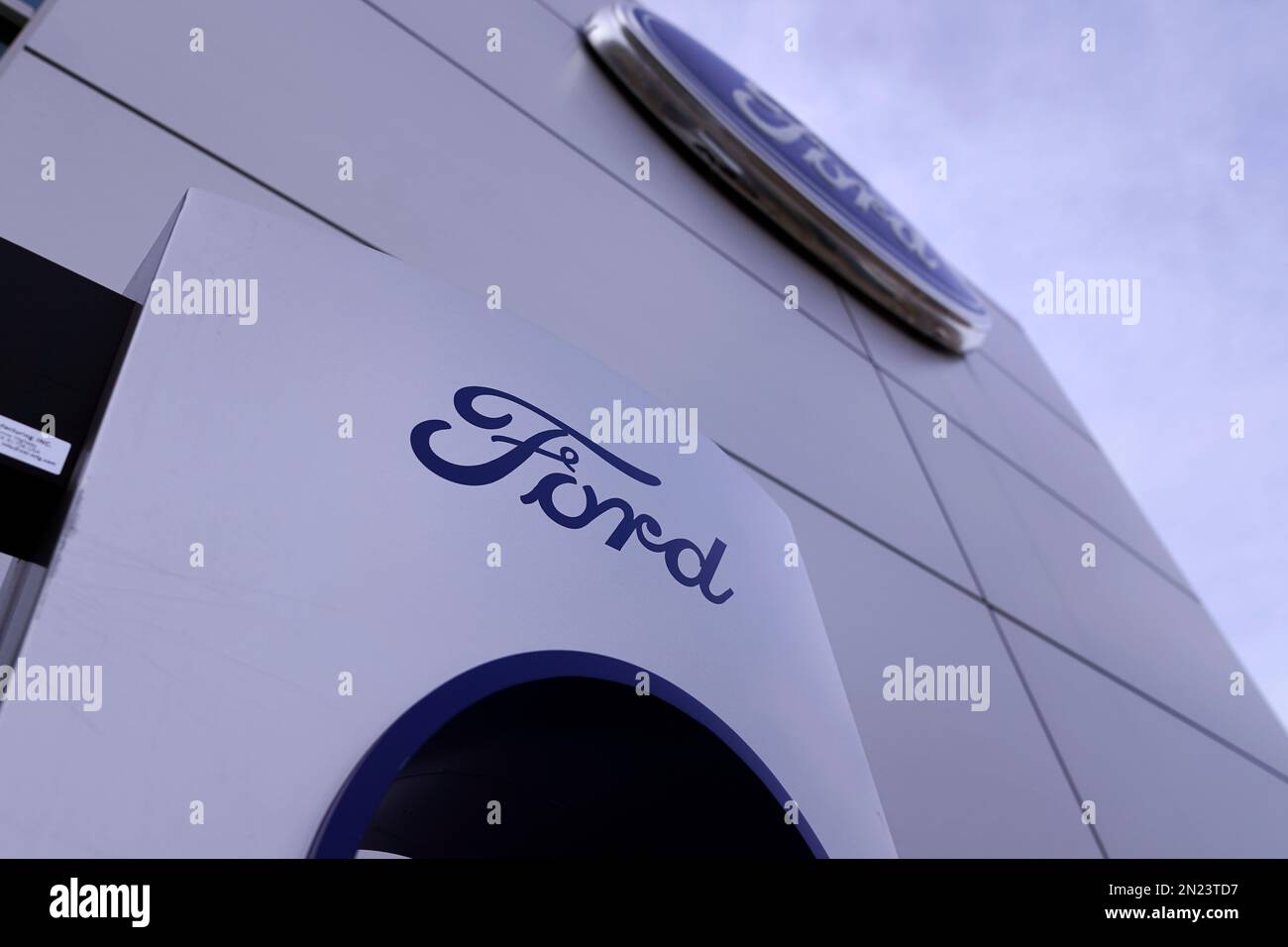 The Ford logo is displayed on an electric vehicle charging station at a ...