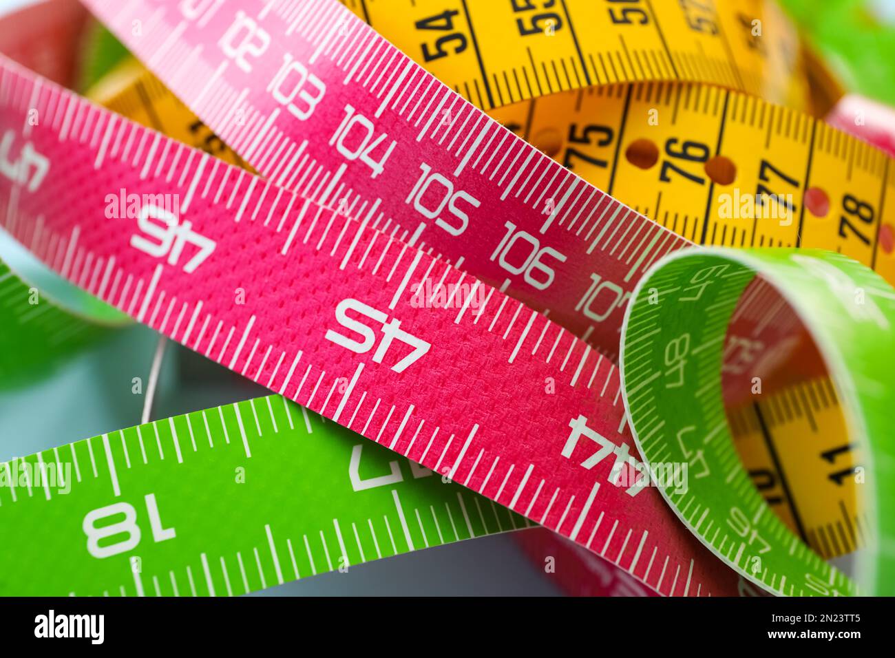 Kit of different measuring tapes as background, closeup Stock Photo - Alamy