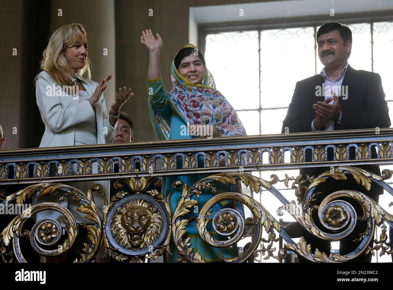 Nobel Peace Prize recipient Malala Yousafzai, center, waves while ...