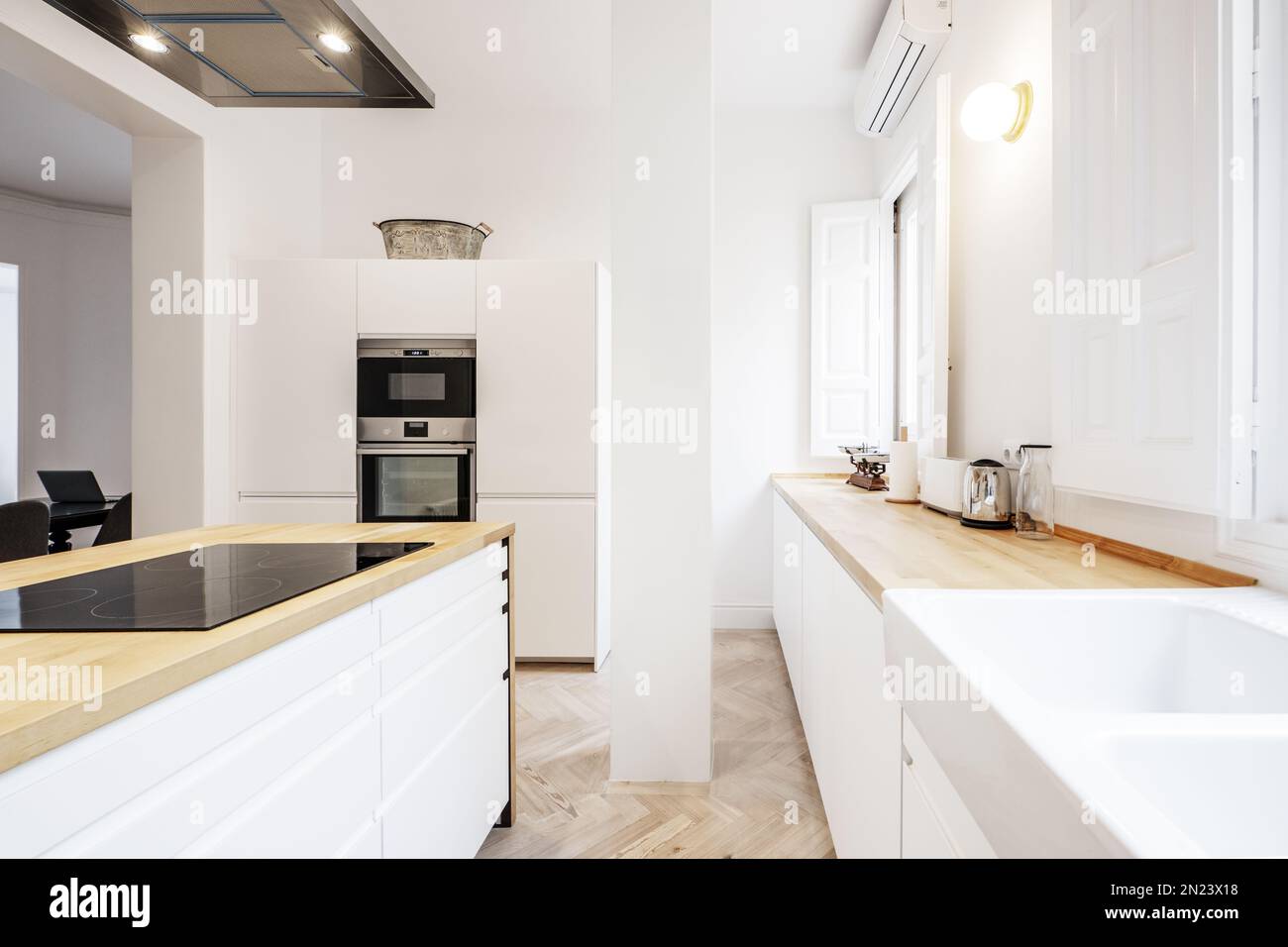 Contemporary designer kitchen with handleless cabinets, center island ...