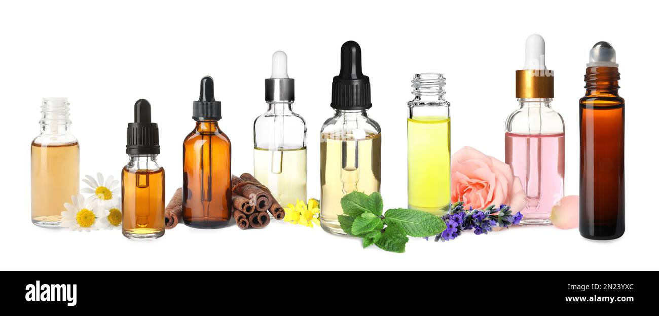 Set of different essential oils used in aromatherapy on white ...