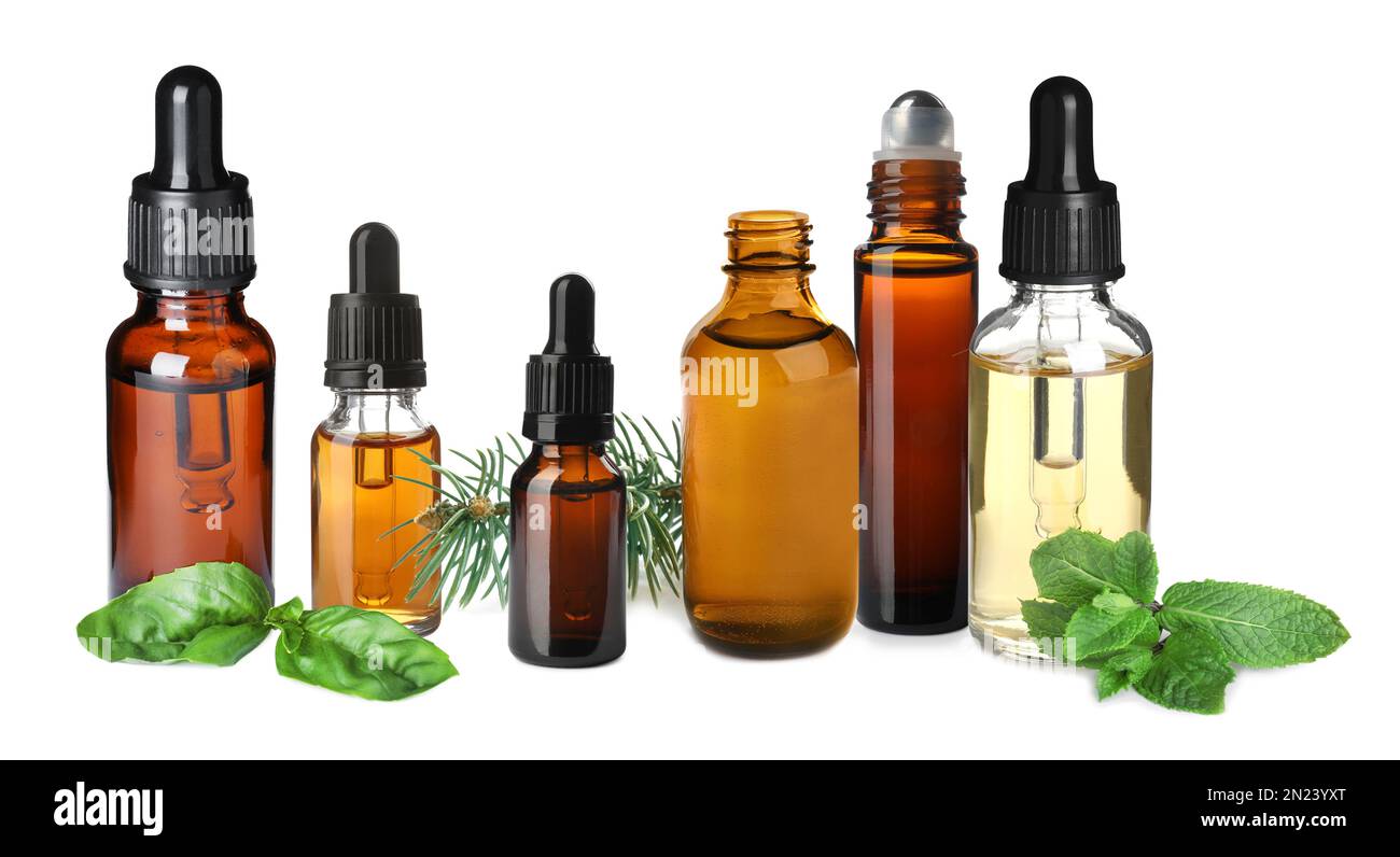 Set of different essential oils used in aromatherapy on white ...