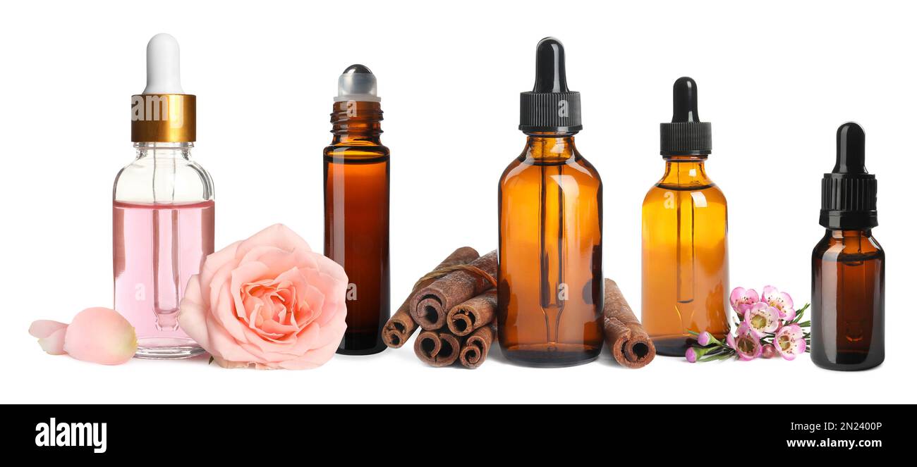 Set of different essential oils used in aromatherapy on white ...