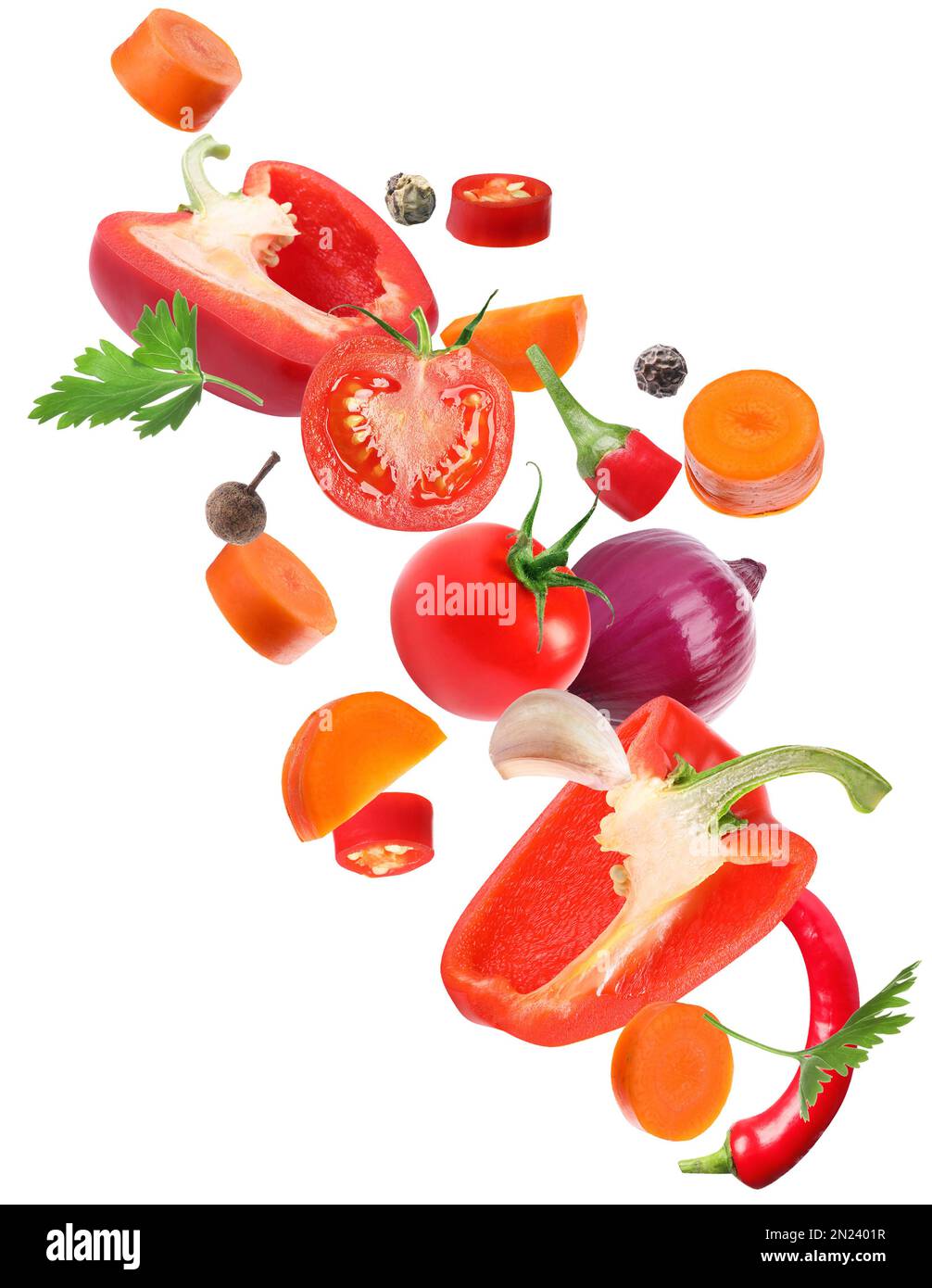 Set of different fresh vegetables and spices falling on white ...