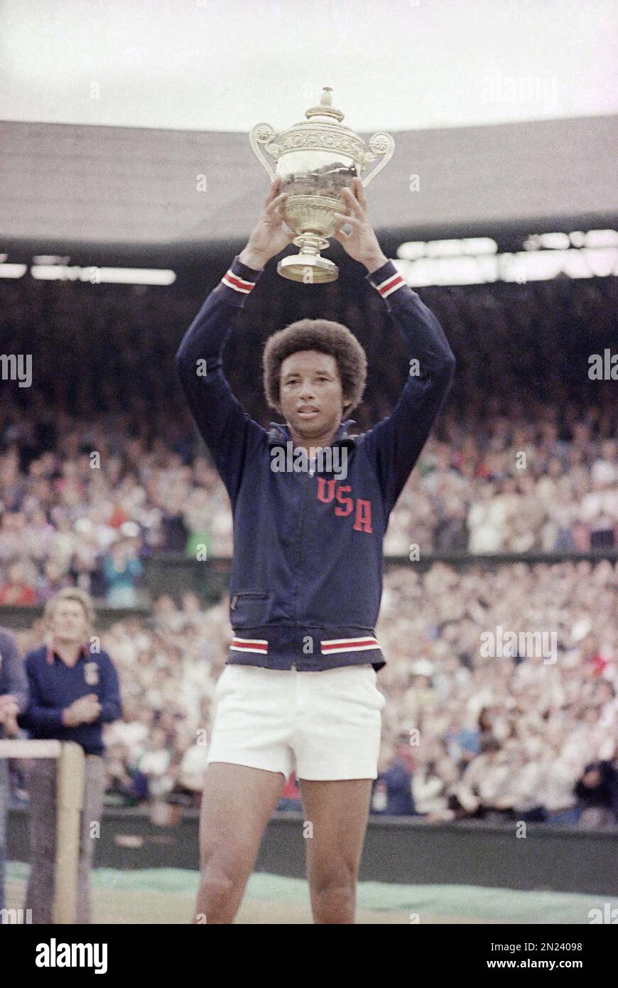 FILE - In this July 5, 1975 file photo, Arthur Ashe holds the men's ...