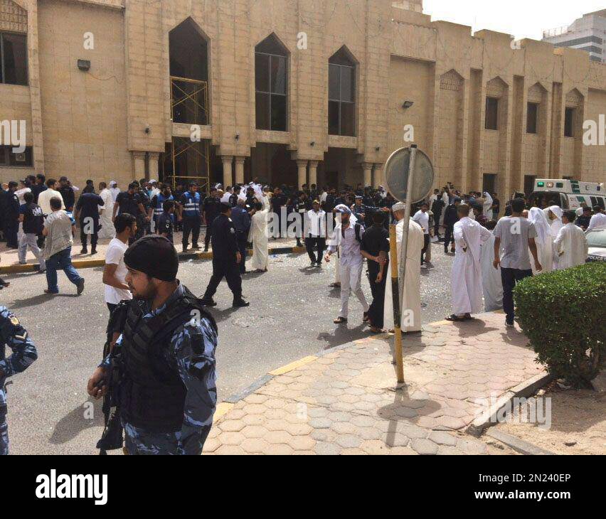 Security forces, officials and civilians gather outside of the Imam ...