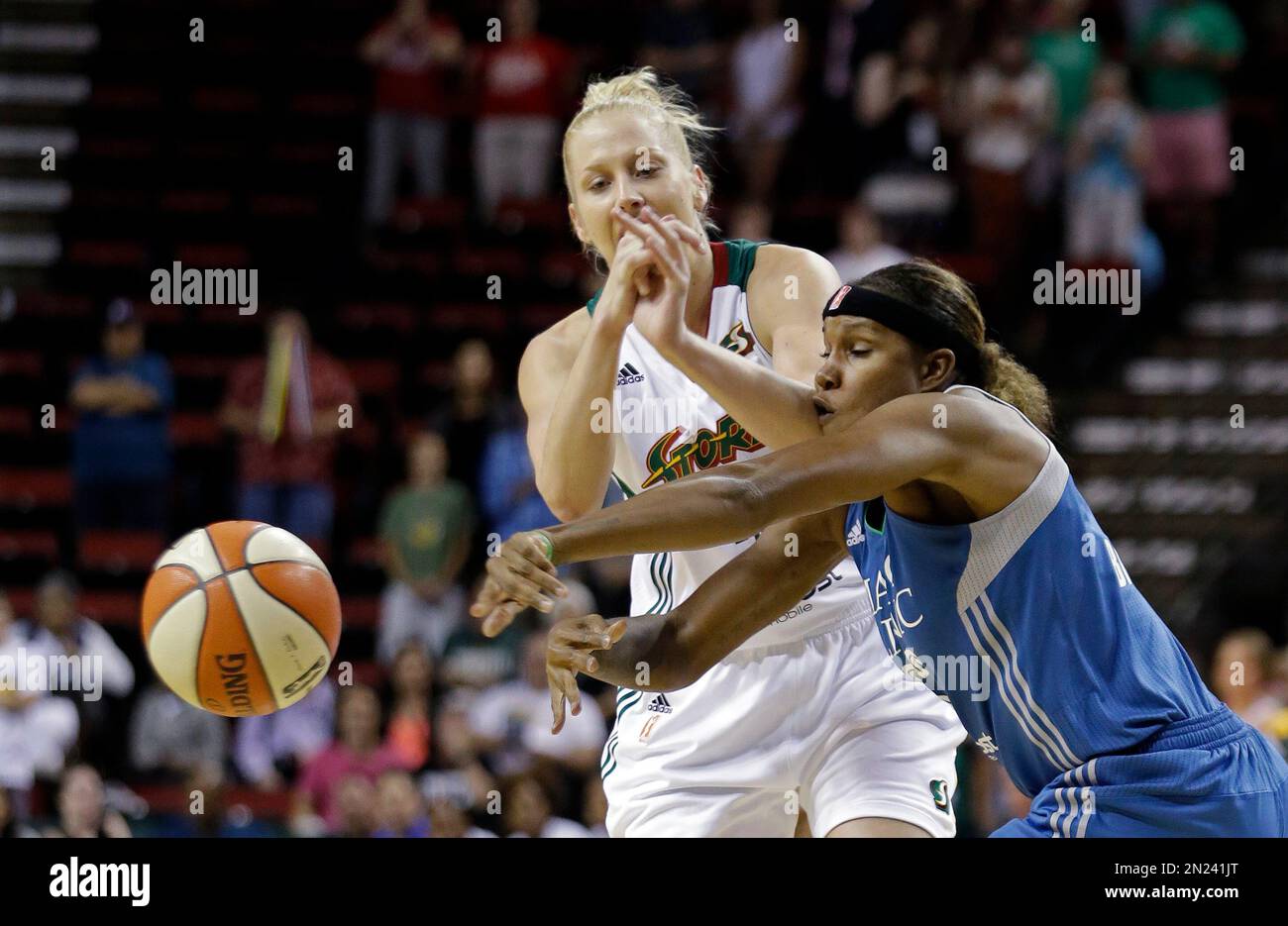 Seattle Storm's Abby Bishop, left, of Australia, collides with ...