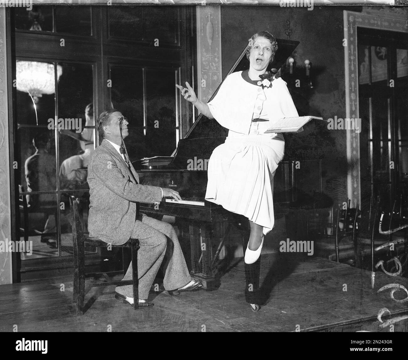 Evangelist Aimee Semple McPherson Hutton rehearses a few bars of her ...