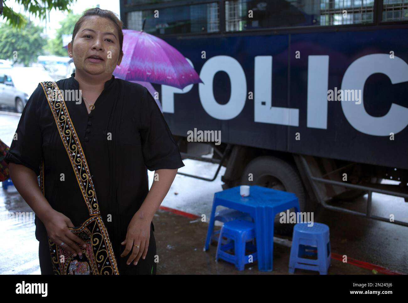 Shwe Hmone, a reporter of a local news journal, talks to journalists ...