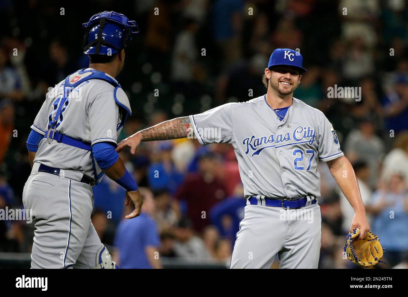Kansas City Royals closing pitcher Brandon Finnegan (27) gives catcher ...