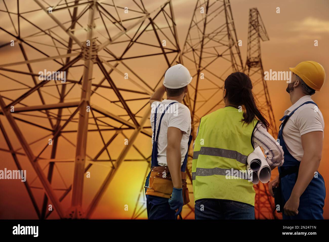 Professional engineers working on installation of electrical substation ...