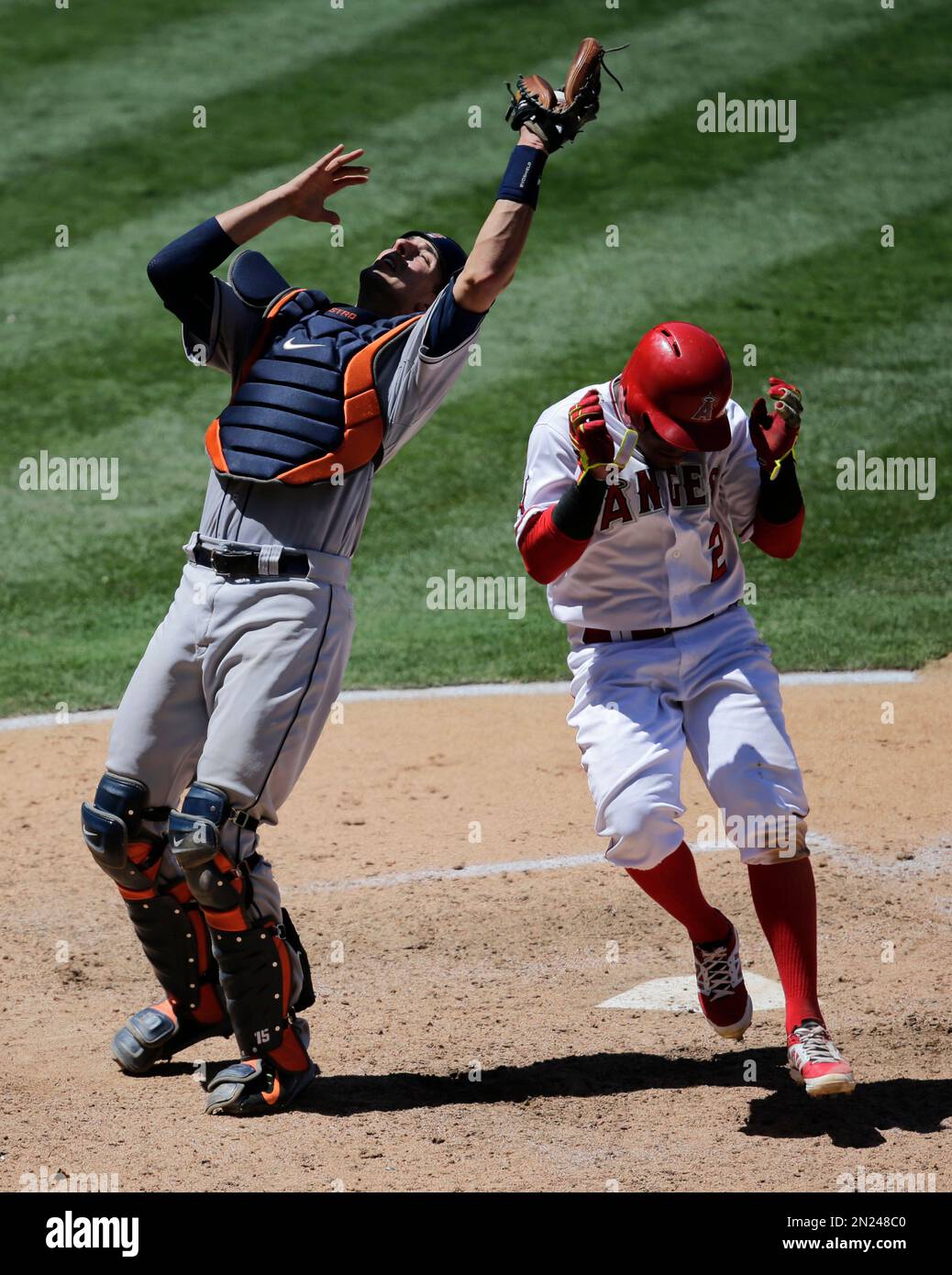 Houston Astros catcher Jason Castro, left, catches a foul ball for the ...