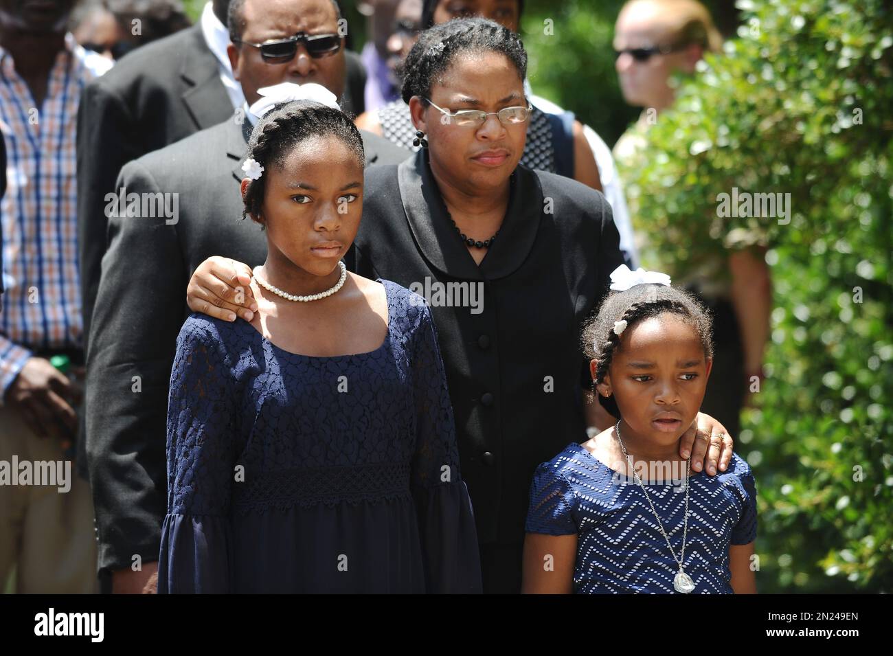 Sen. Clementa Pinckney's wife Jennifer Pinckney, center, and her ...