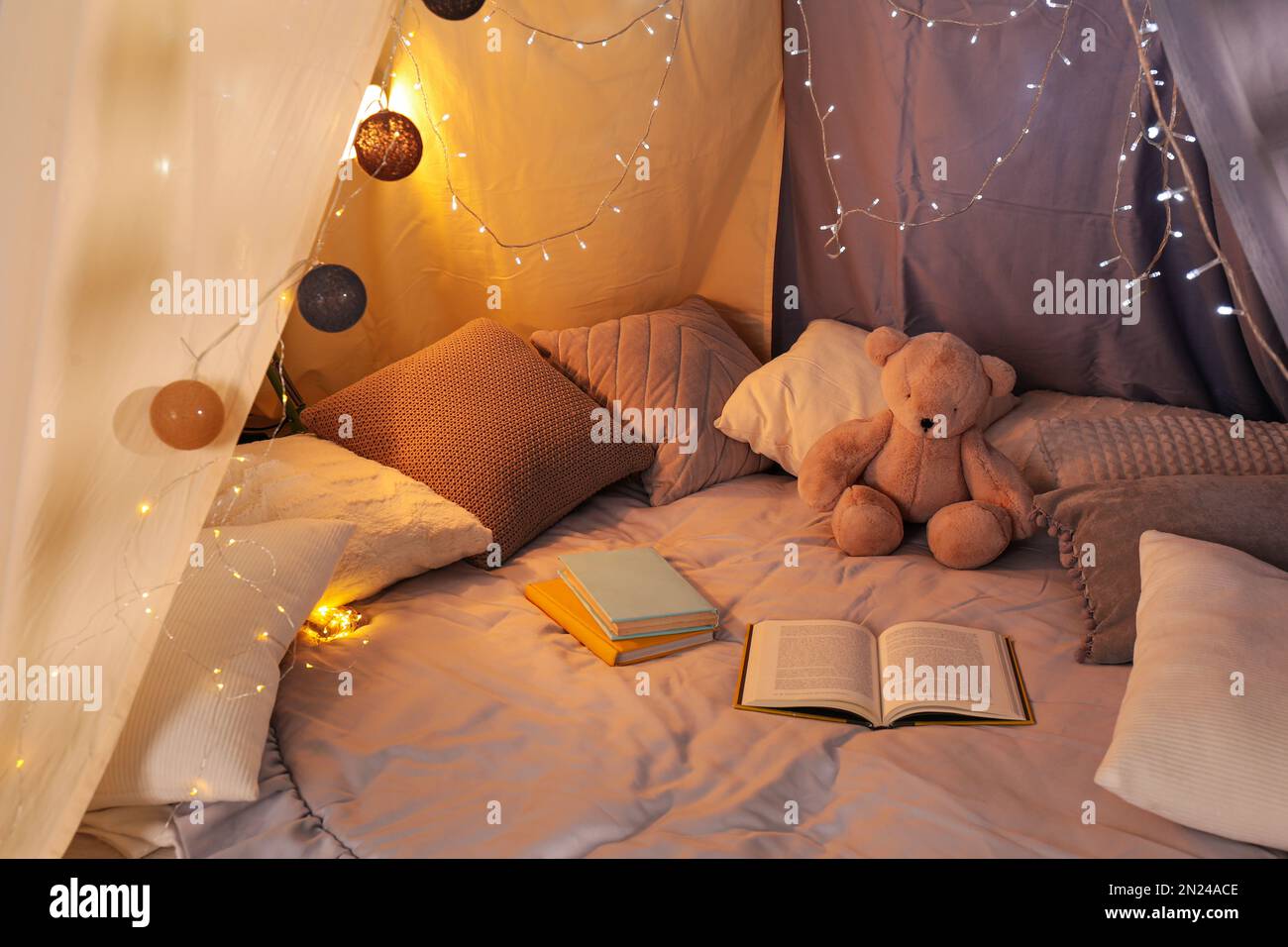 Play tent with books, pillows and Teddy bear. Modern children's room ...