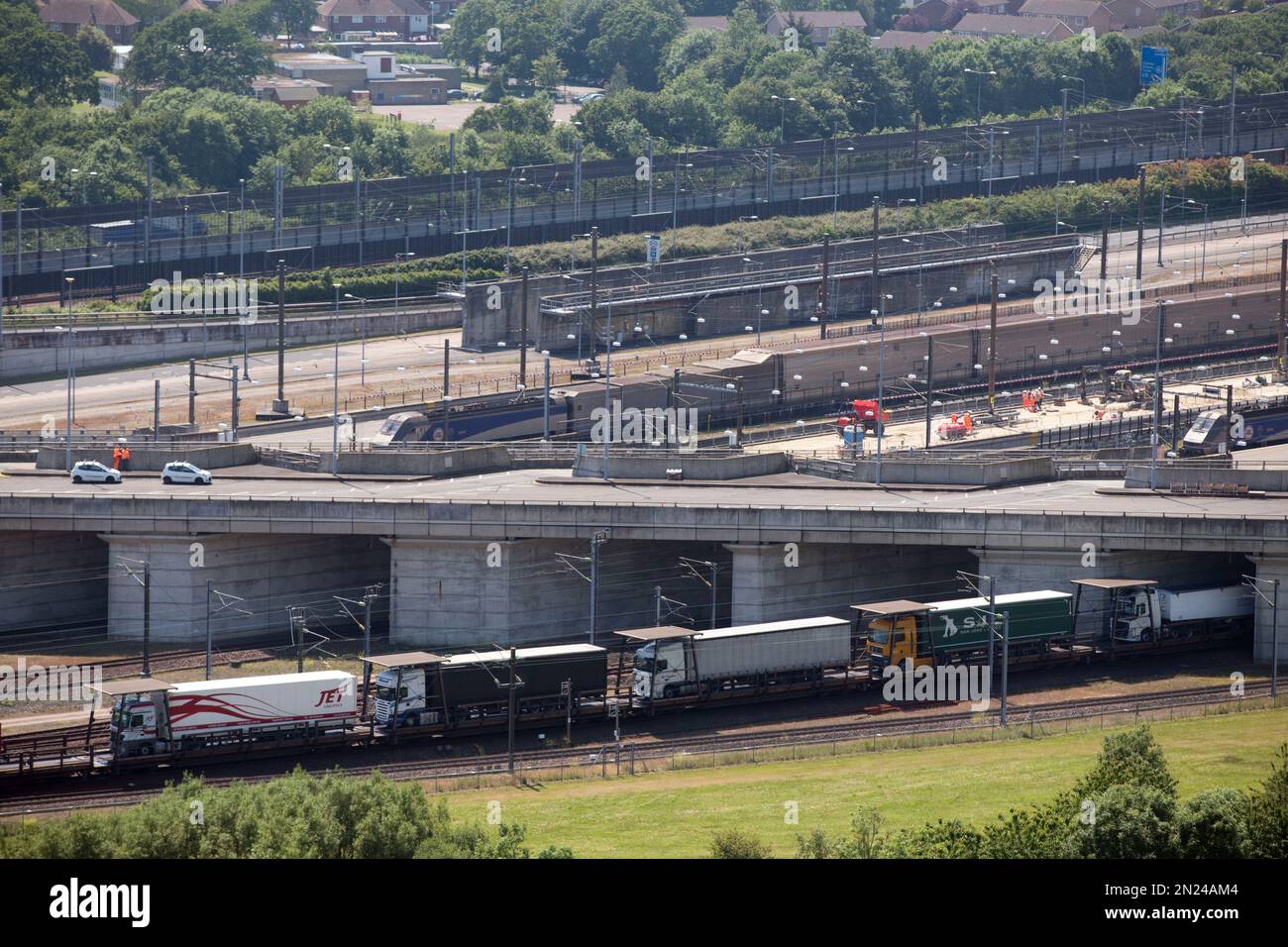 Lorries are transported on a train to enter the Channel Tunnel in ...
