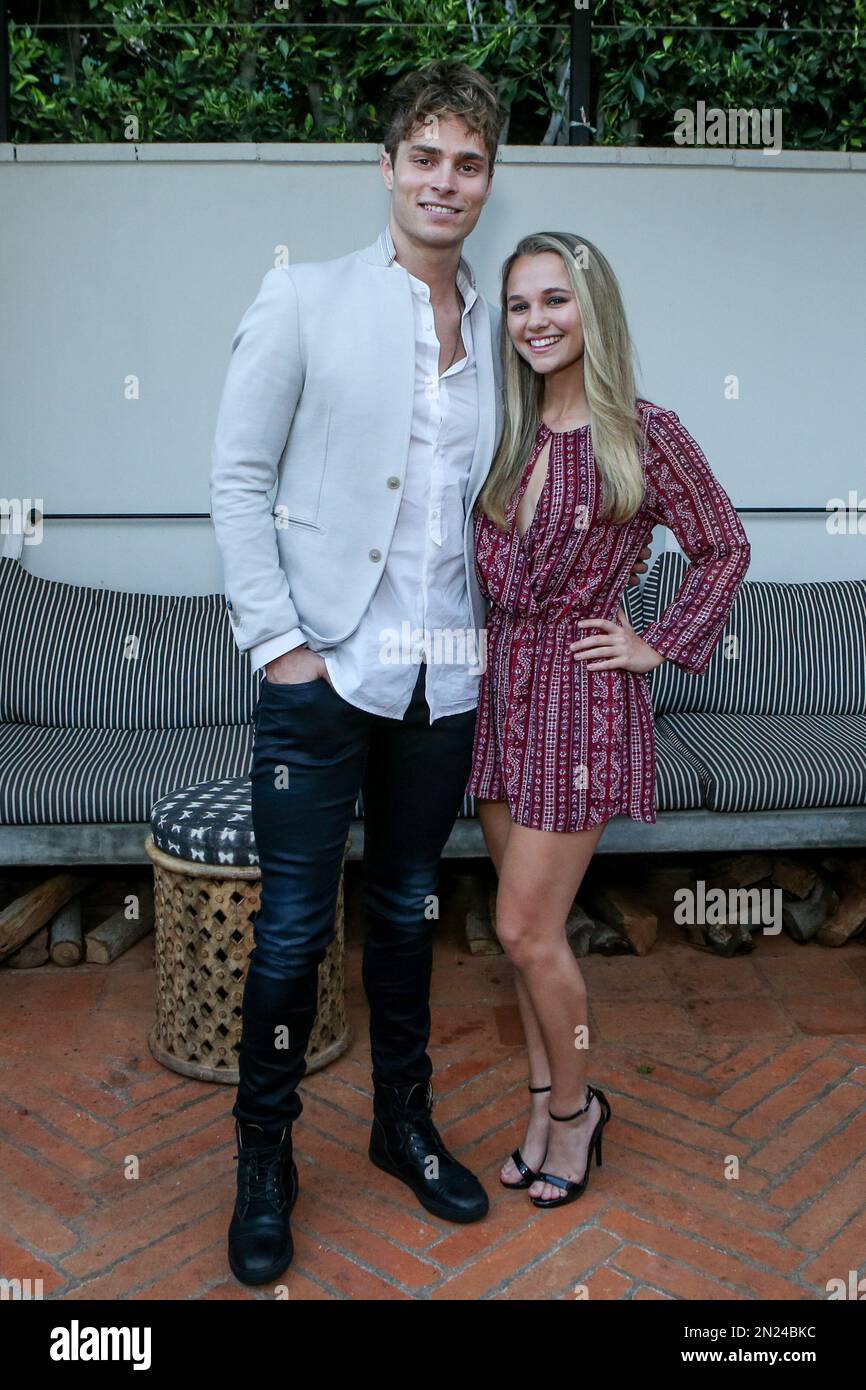Spencer Sutherland and Madison Iseman attend the BCBGeneration Summer Solstice Party at Gracias ...