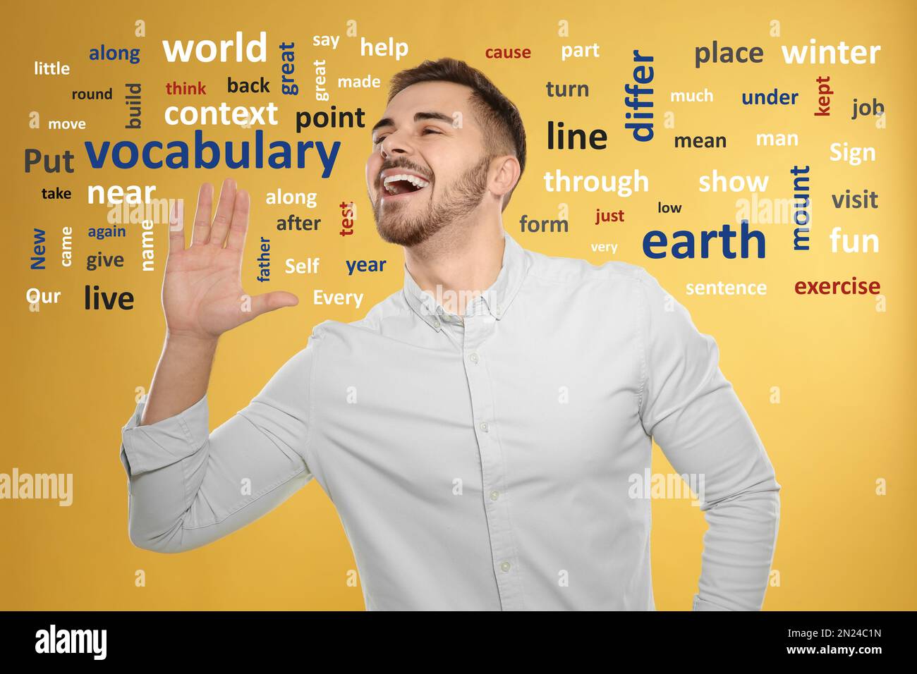 Happy young man surrounded by word cloud on yellow background Stock ...