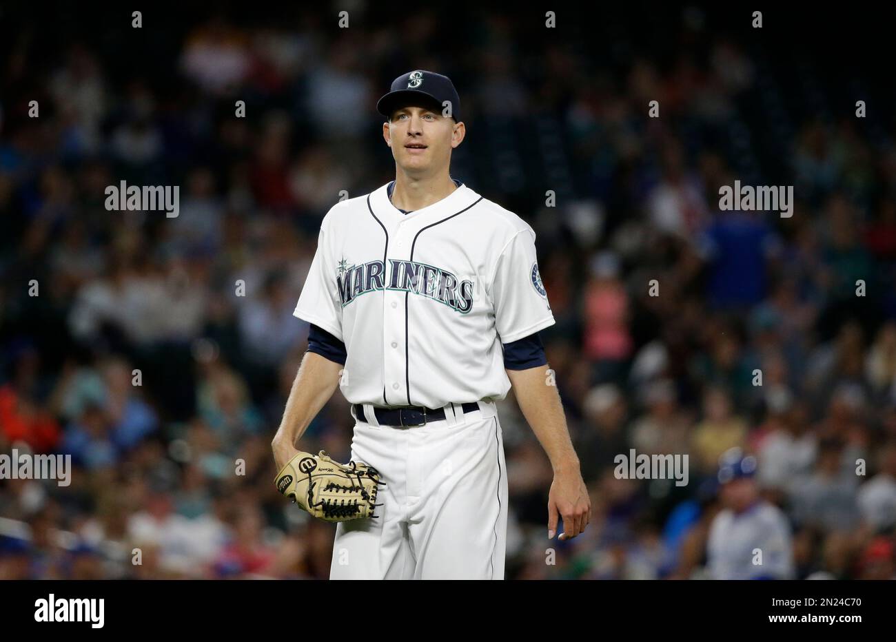 Seattle Mariners starting pitcher Mike Montgomery walks off the field ...
