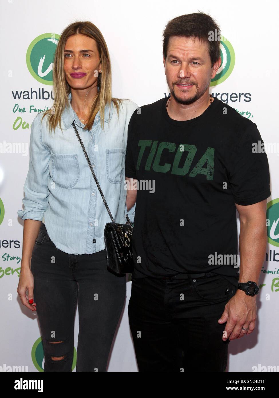 Rhea Durham, left, and Mark Wahlberg, right, attend the Wahlburgers ...