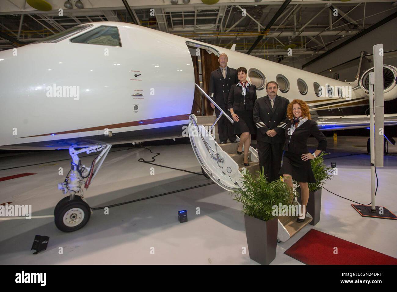Flexjet pilots and flight crew stand by the G450 was delivered Tuesday ...