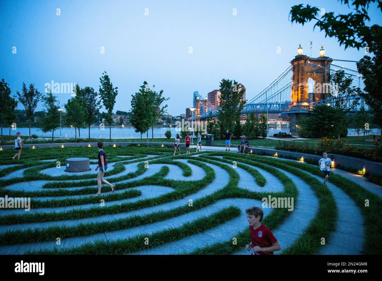 Pedestrians navigate a labyrinth at Smale Riverfront Park in Cincinnati ...