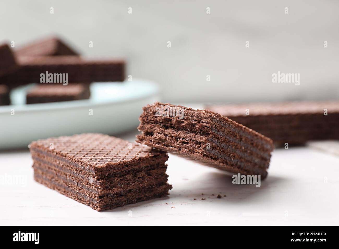 Delicious chocolate wafers on white table, closeup Stock Photo - Alamy