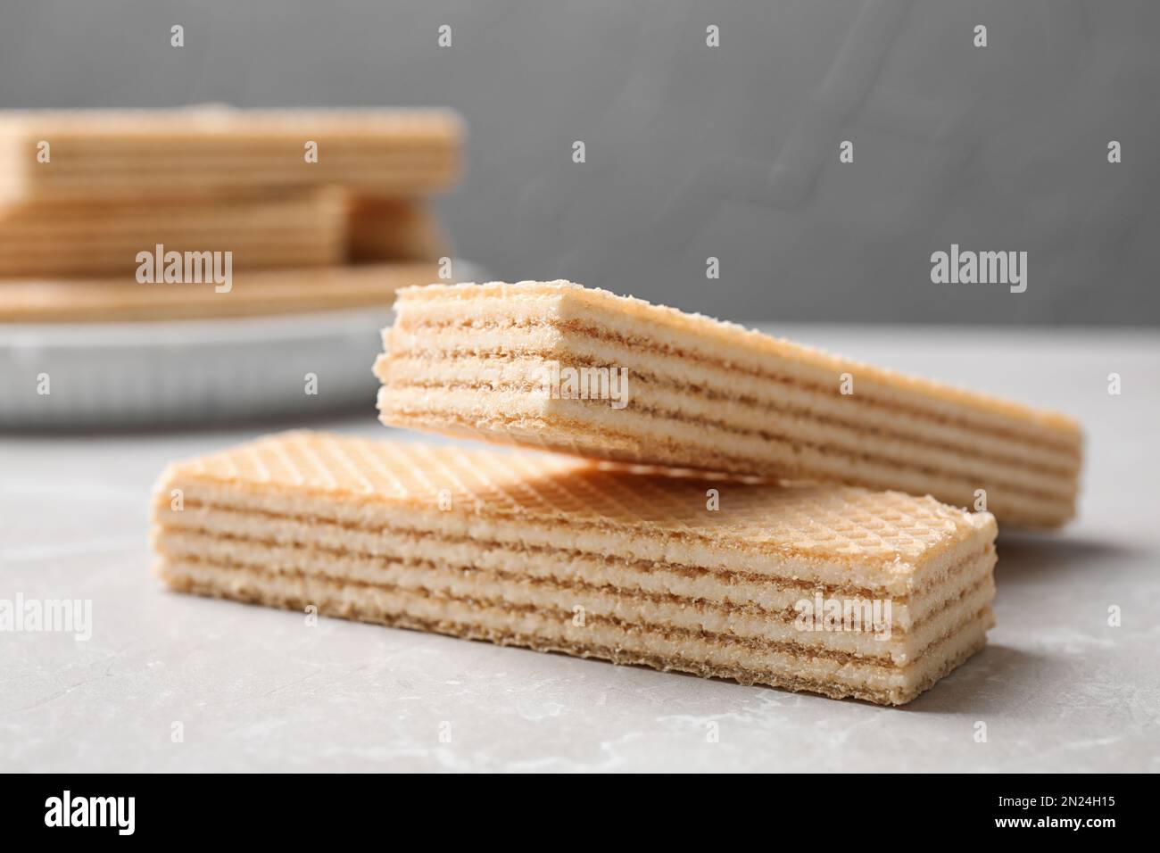 Delicious cream wafers on light grey marble table, closeup Stock Photo ...