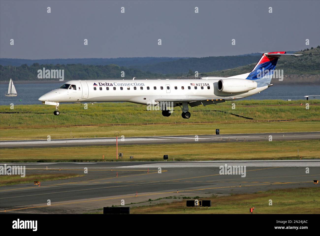 Delta Connection airlines Embraer plane landing on airport runway Stock ...