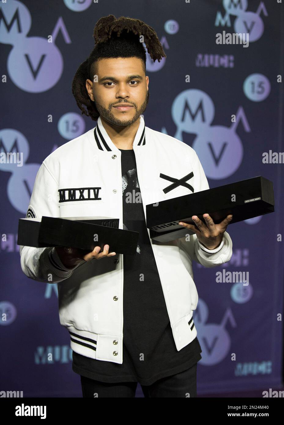 The Weeknd poses in the press room at the Much Music Video Awards on ...