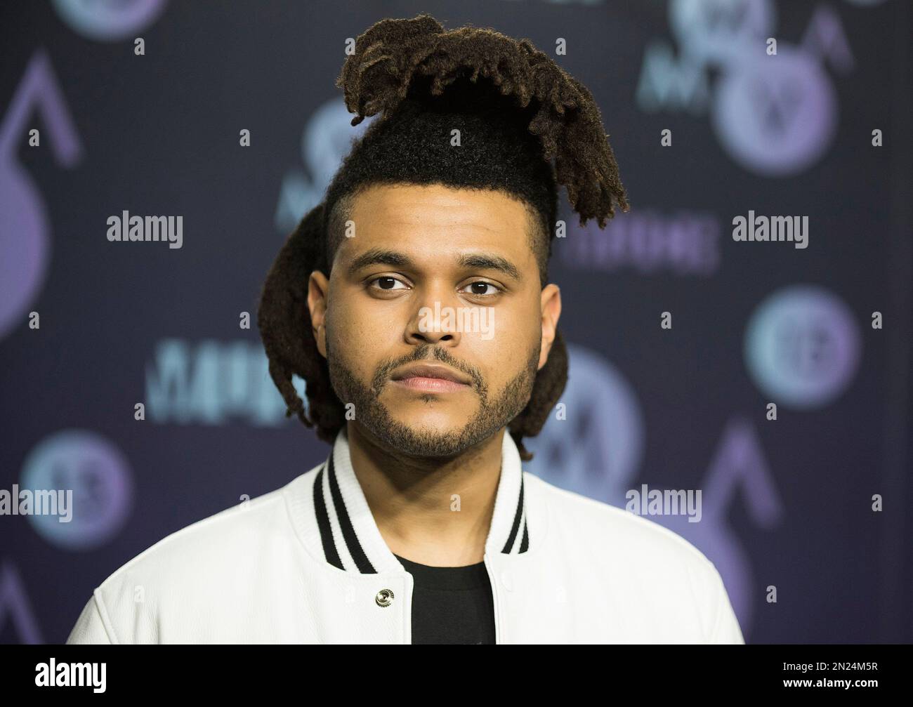 The Weeknd poses in the press room at the Much Music Video Awards on ...