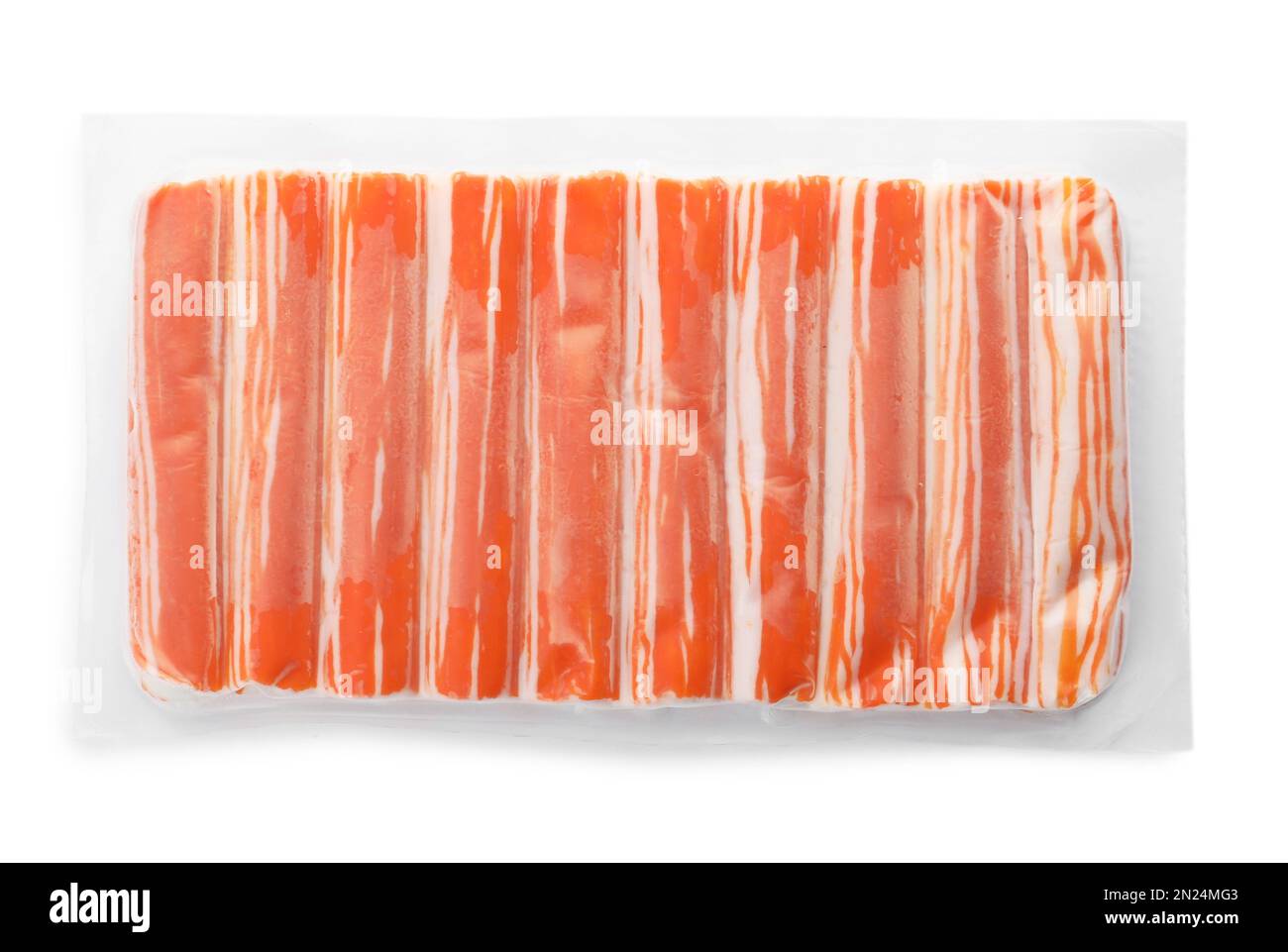 Delicious crab sticks in plastic packaging isolated on white, top view ...