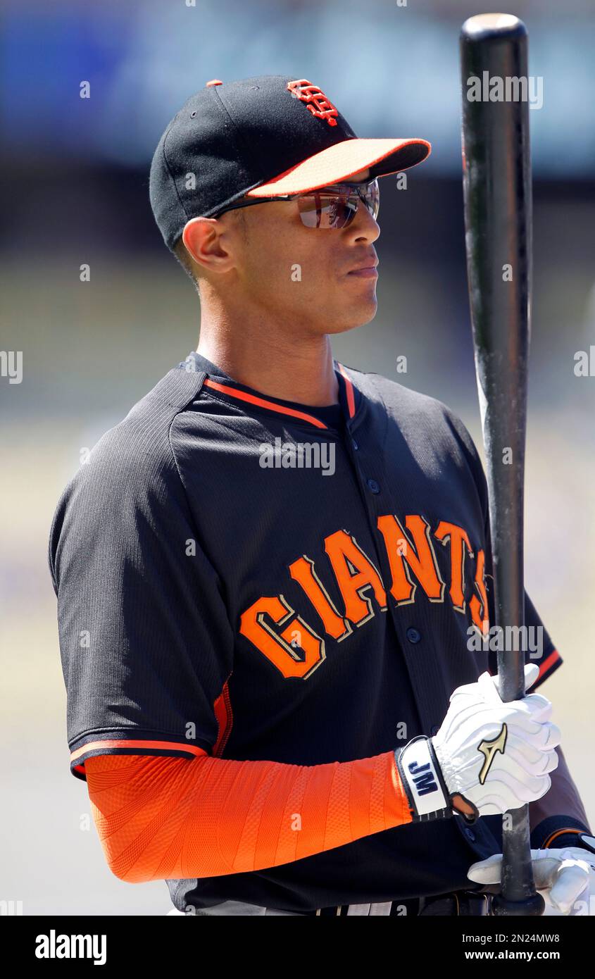 San Francisco Giants' Justin Maxwell looks over at the batting cage ...