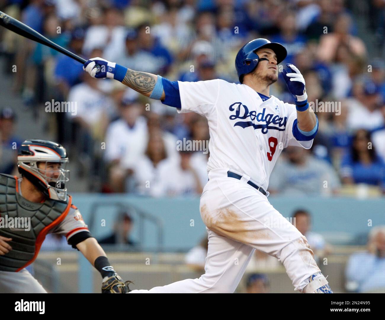 Los Angeles Dodgers’ Yasmani Grandal hits a solo home run with San Francisco Giants catcher ...