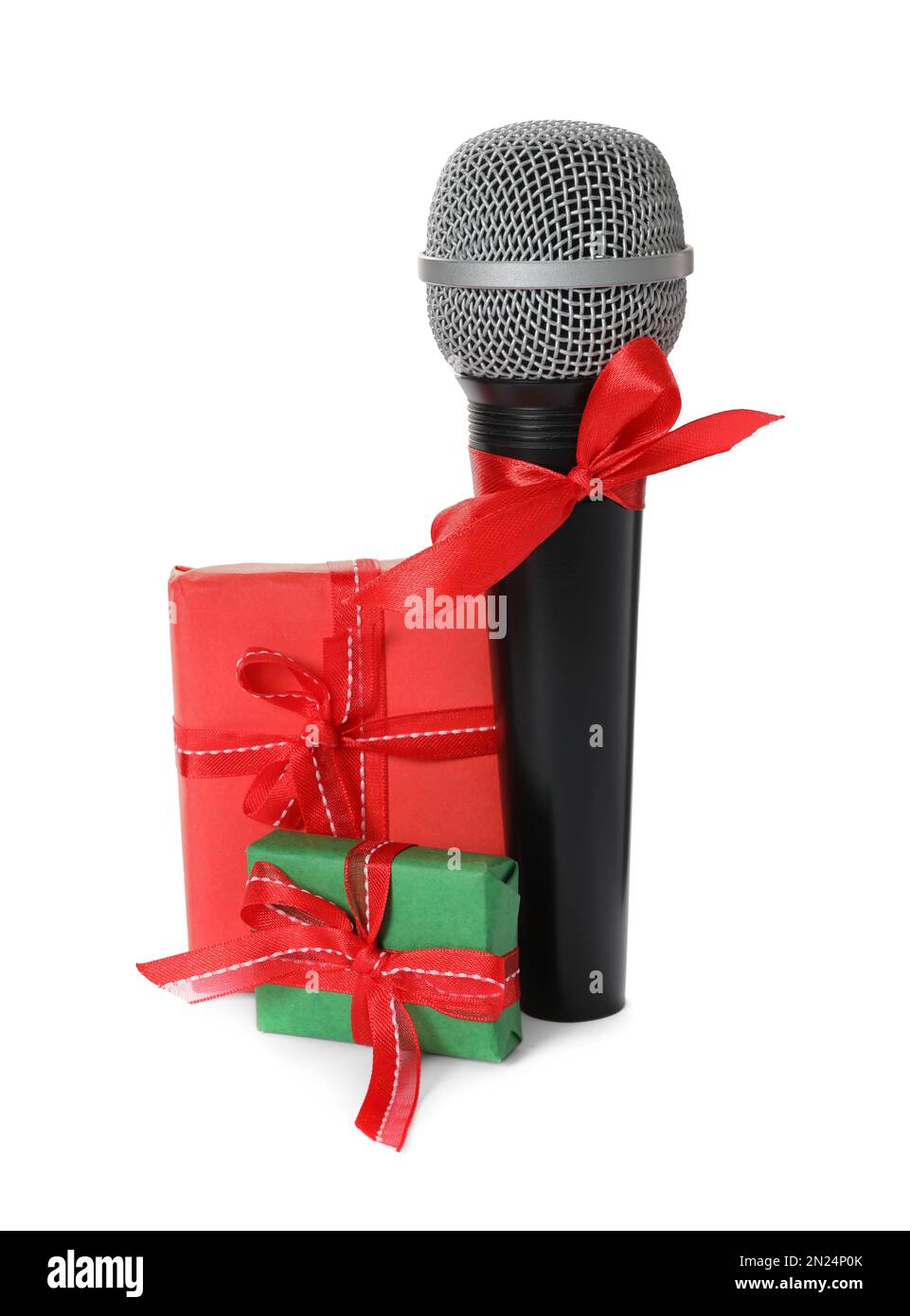 Microphone with red bow and gift boxes on white background. Christmas ...