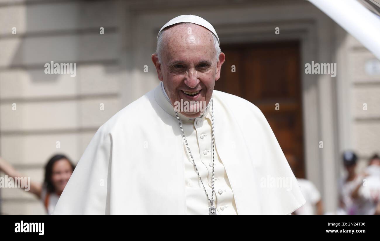 Pope Francis smiles as he arrives at the Santa Maria Ausiliatrice ...