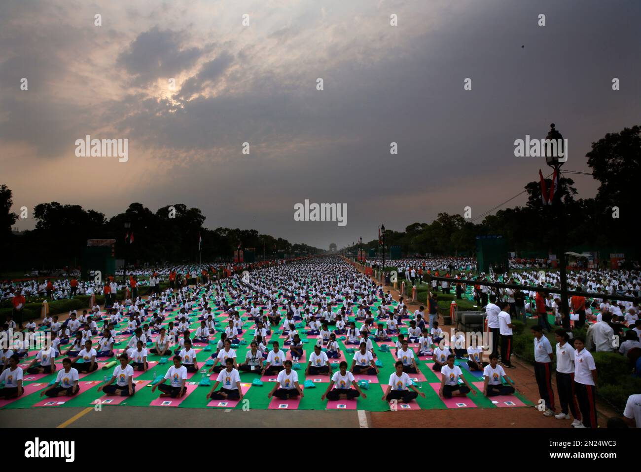 Indians perform yoga on Rajpath, in New Delhi, India, Sunday, June 21 ...