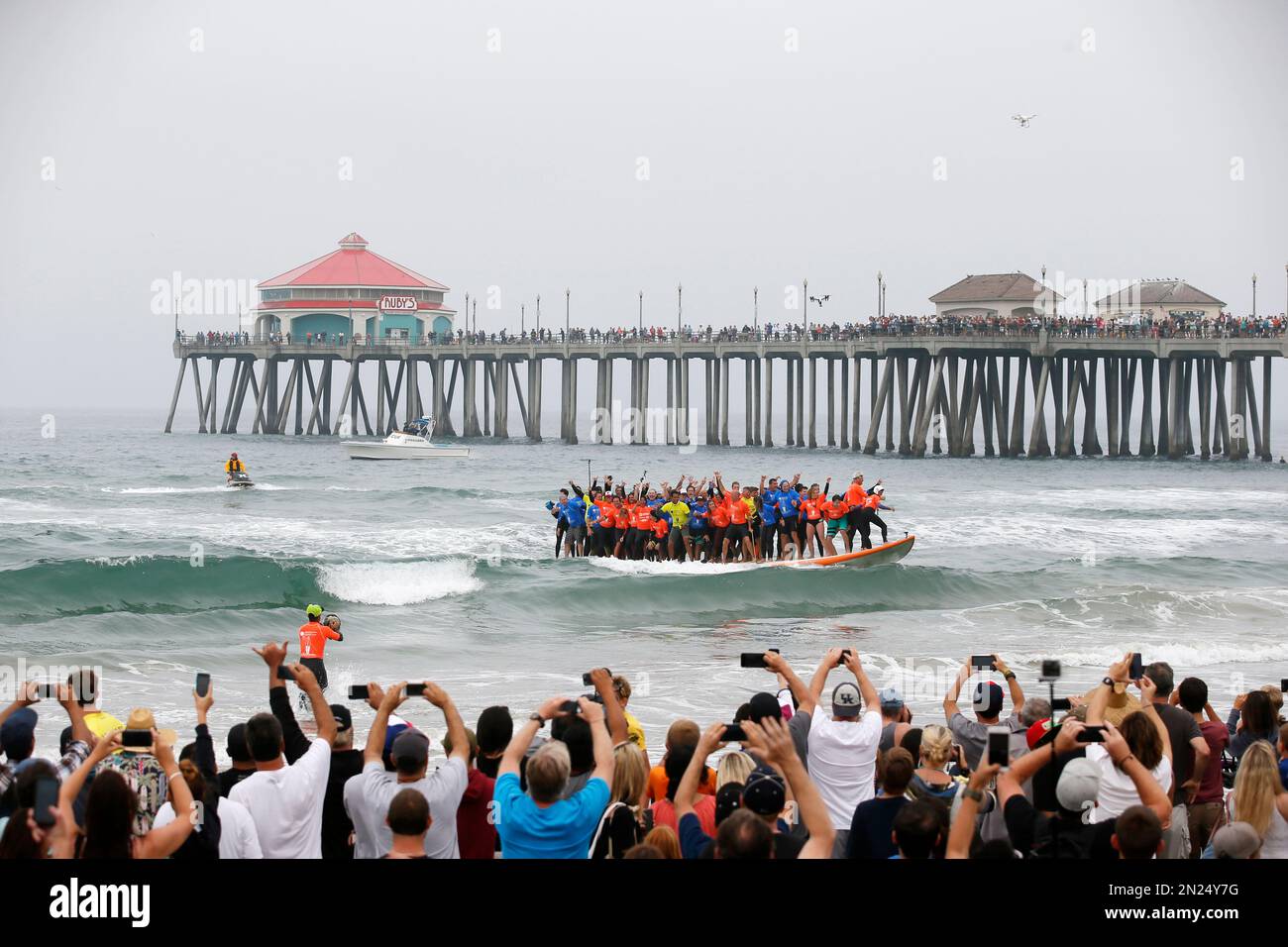 Sixty-six surfers from around the world ride a custom built 42-foot ...